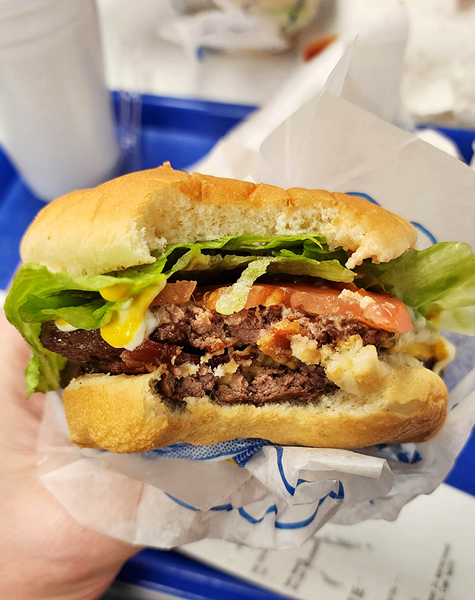 This isn't just a cheeseburger; it's a masterclass in flat-top grilling. The cheese melts into the patty like it's finding its soulmate.