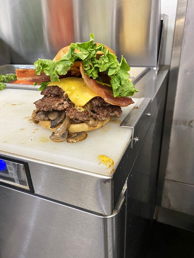 This bacon burger isn't just food—it's architecture, with each layer building toward a perfect bite of savory bliss.