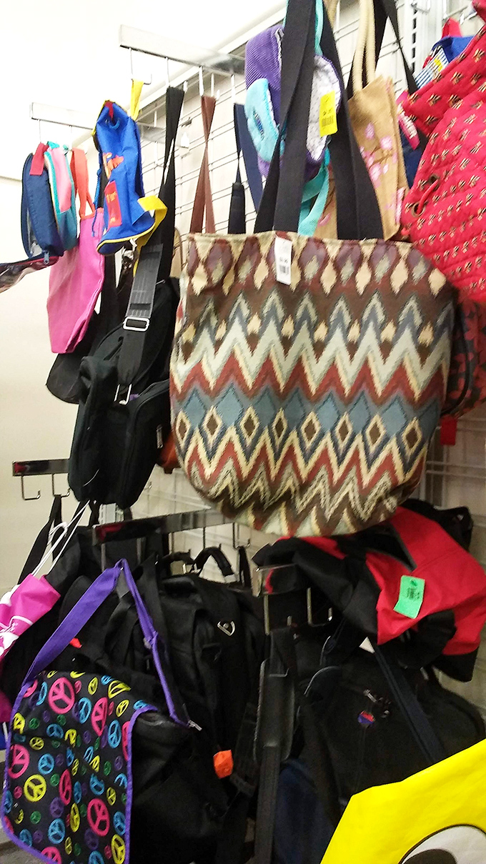 Bags hang like colorful flags of surrender to the irresistible force of a good bargain.