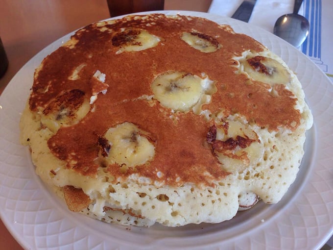 Banana pancakes that achieve the impossible: fluffy yet substantial, sweet yet not cloying, and large enough to qualify as a small throw rug.