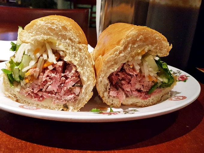 The bánh mì sandwich: where French colonial influence meets Vietnamese ingenuity, resulting in a crusty-outside, tender-inside handheld masterpiece stuffed with savory goodness.