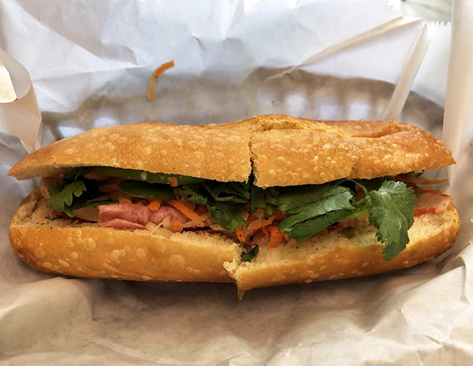 The b&aacute;nh m&igrave; at Mi Li is architectural perfection&mdash;crispy exterior, fresh fillings, and that crucial balance of savory meat, bright herbs, and tangy vegetables.