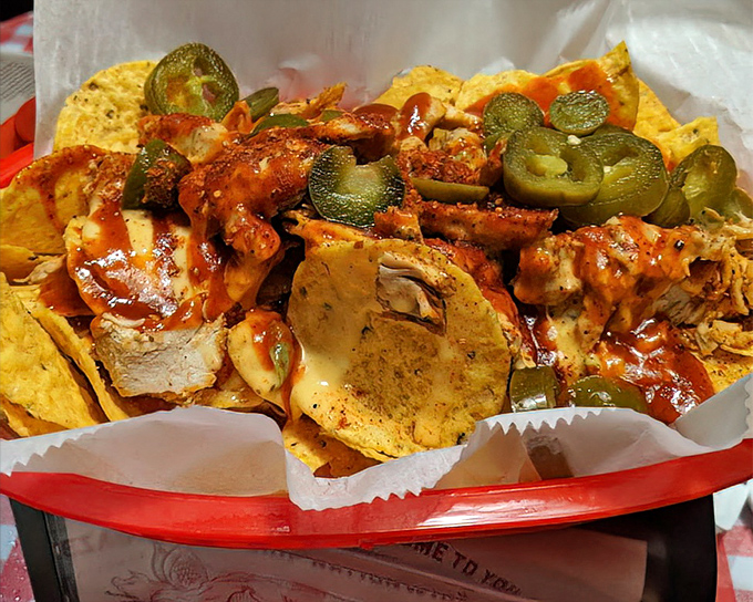 Barbecue nachos that blur the line between appetizer and main event. Crispy chips playing hide-and-seek under a mountain of smoky goodness.