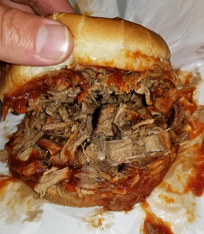 This isn't just pulled pork &ndash; it's meat that's had a spa day. Slow-smoked, hand-pulled, and sauced to perfection in a sandwich that demands two hands.