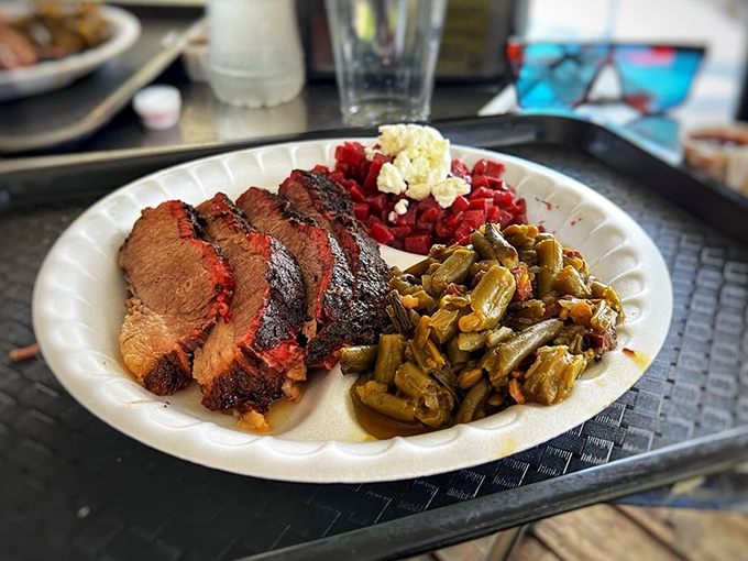 Brisket that doesn't need a passport to transport you to Texas. The pink smoke ring and glistening bark tell you everything you need to know about the journey ahead.