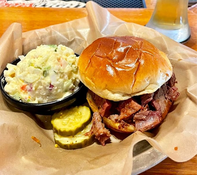 This brisket sandwich isn't just a meal, it's an architectural achievement &ndash; meat piled so high it deserves its own zip code.