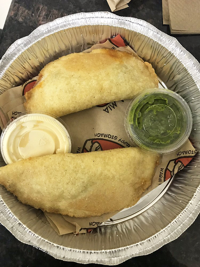 These empanadas aren't just fried pockets of joy&mdash;they're crispy vessels of culinary diplomacy, bringing Venezuelan street food straight to Georgia with two perfect dipping sauces.