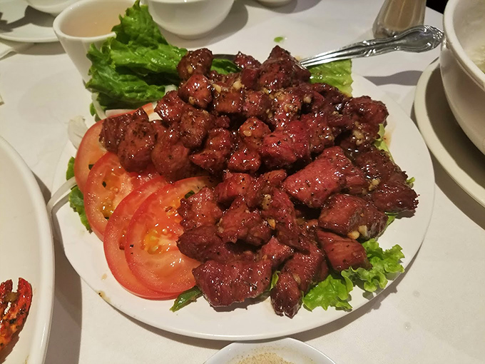 The Beef Loc Lac arrives like a carnivore's dream&mdash;tender cubes of seared beef resting on crisp lettuce and tomato, a French-Vietnamese masterpiece that deserves its own fan club.