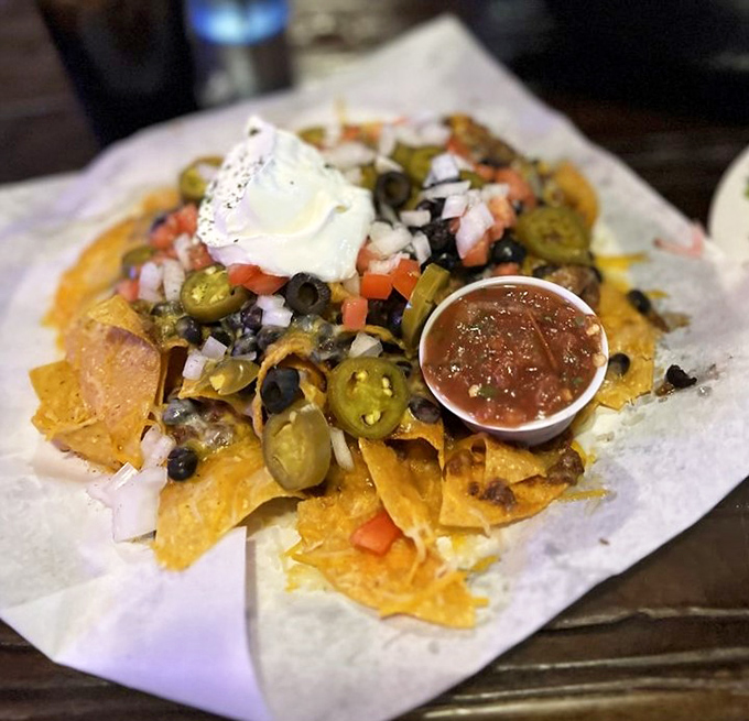 These loaded nachos aren't just a appetizer, they're an architectural achievement of cheese, jalape&ntilde;os, and all the fixings your heart desires.
