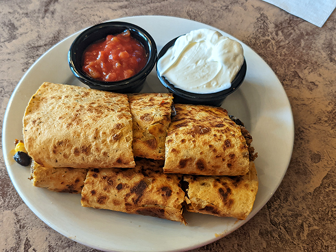 Quesadillas done right&mdash;golden-brown tortillas with just enough char, served with the holy trinity of toppings: salsa, sour cream, and guacamole.