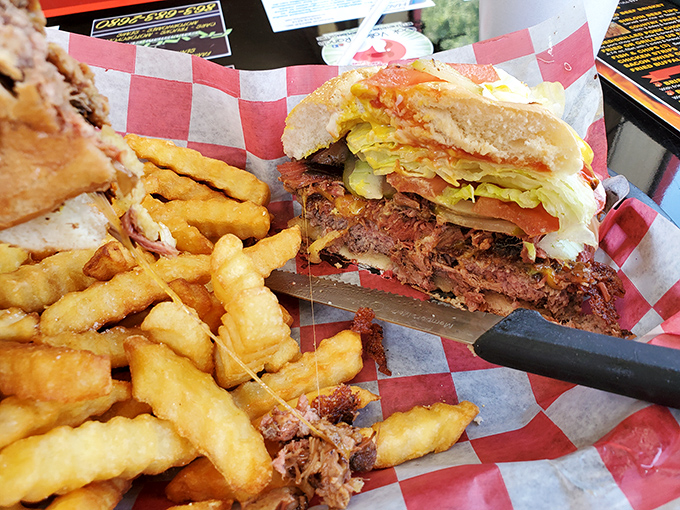 This isn't just a sandwich&mdash;it's an architectural marvel of beef, cheese, and toppings that requires both hands, several napkins, and zero shame.