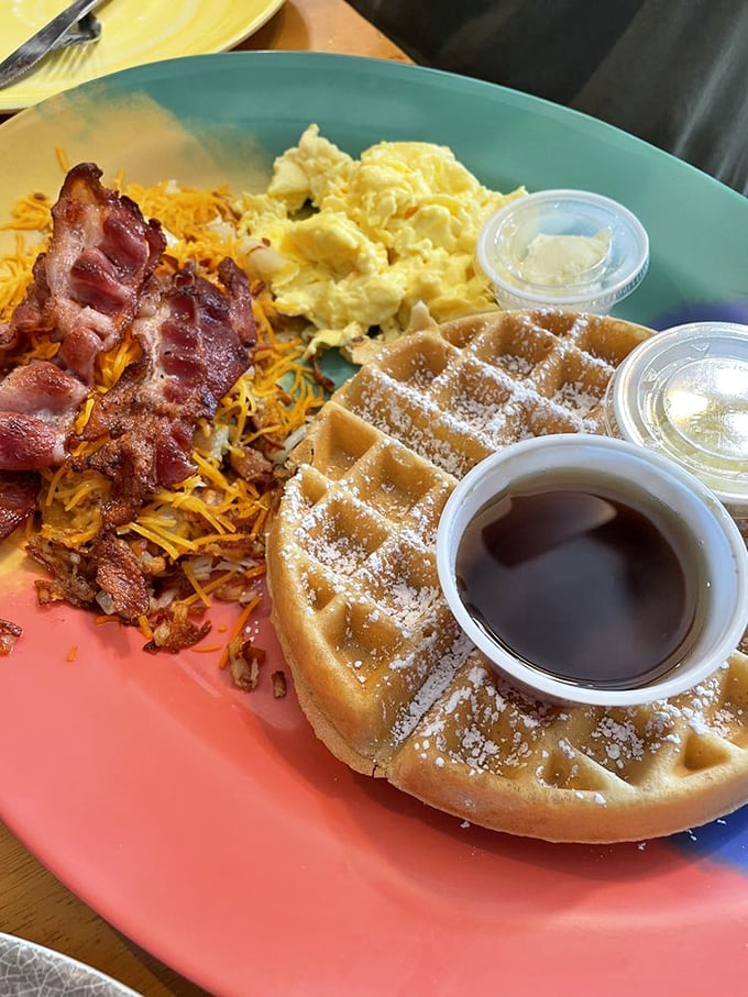 The Belgian waffle, scrambled eggs, and bacon trifecta&mdash;breakfast's holy trinity served on colorful plates that brighten even Monday mornings.