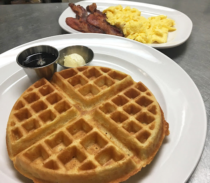 This golden Belgian waffle has the structural integrity engineers dream about, with perfect pockets ready to capture butter and syrup in delicious harmony.