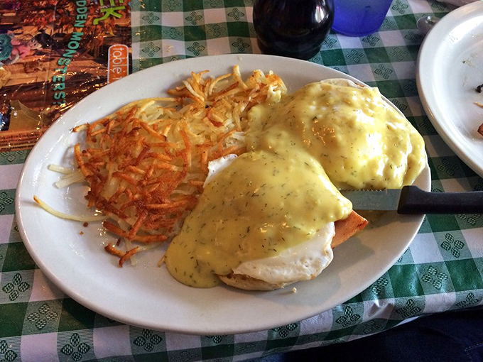 Eggs Benedict done right—crispy hash browns and hollandaise sauce that would make a French chef tip their toque.