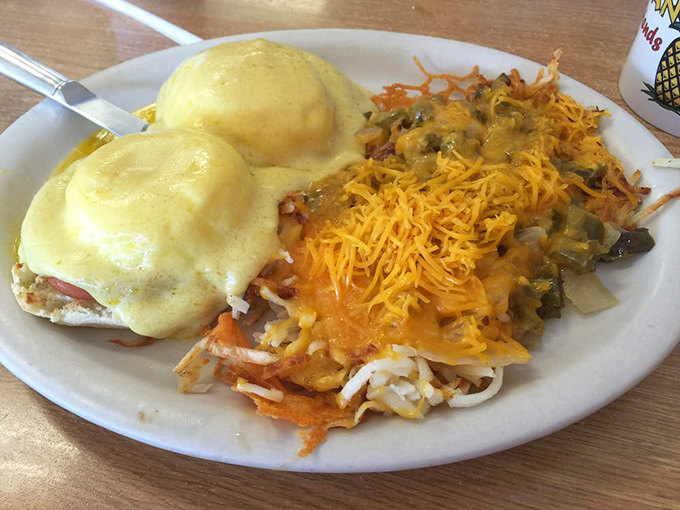 Eggs Benedict that would make the Pope jealous&mdash;hollandaise draped over English muffins like a velvet robe, with hash browns playing the perfect supporting role.