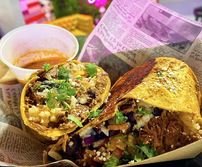 These birria burritos are stuffed so full they're practically bursting at the seams, wrapped tight and ready for their close-up.