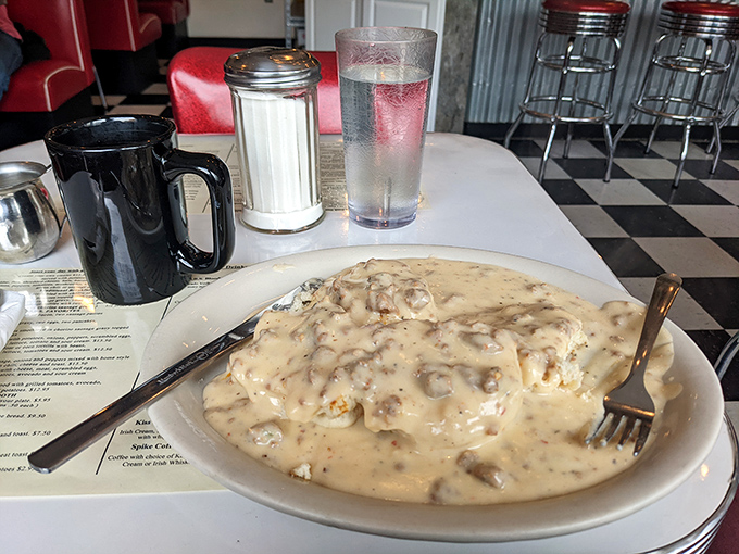 Biscuits and gravy that doesn't just stick to your ribs—it hugs your soul. The kind of dish grandmothers approve of and cardiologists forgive.