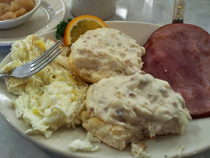 These biscuits and gravy could make a Southern grandmother weep with joy&mdash;pillowy clouds of dough smothered in peppery gravy that demands to be savored slowly.