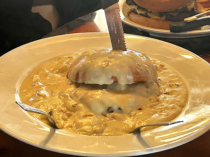 Biscuits smothered in creamy gravy that would make your cardiologist wince but your soul sing with comfort-food joy.