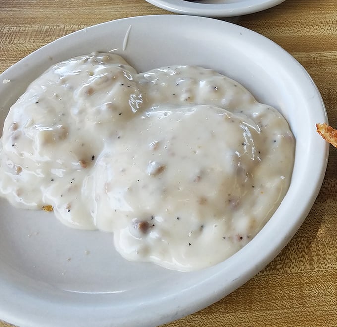 Biscuits and gravy – the South's greatest contribution to breakfast culture. This creamy, peppery blanket of comfort could cure whatever ails you.