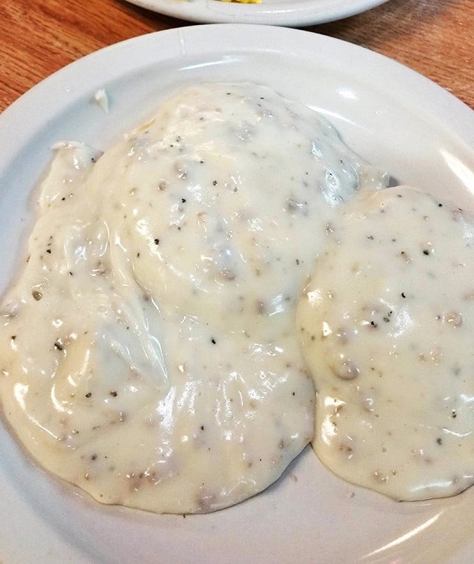 Biscuits swimming in creamy pepper gravy – the breakfast equivalent of a warm hug. Southern comfort food that sticks to your ribs and your memories.