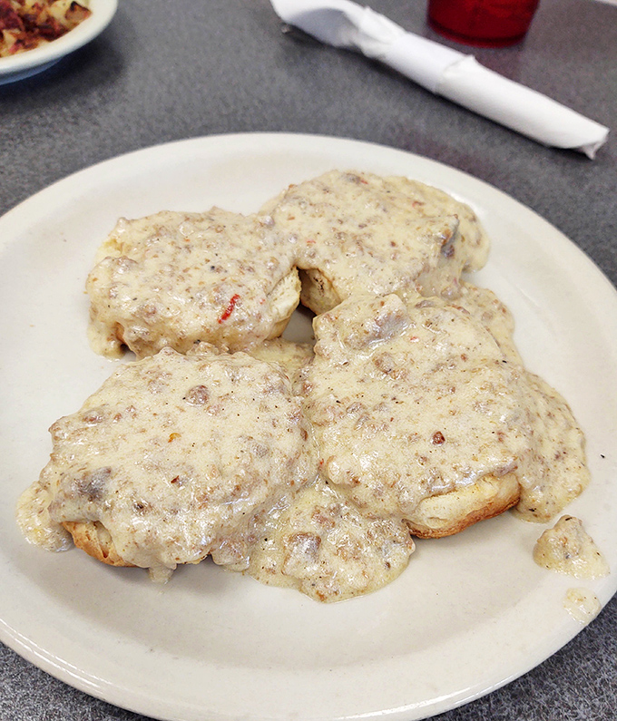 Biscuits and gravy that would make your Southern grandmother nod in approval &ndash; a creamy, peppery blanket covering pillowy biscuits that dissolve with each heavenly bite.