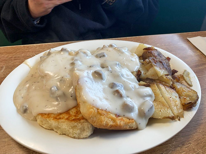 These biscuits and gravy aren't just a meal&mdash;they're Southern poetry on a plate. The kind of dish grandmothers fight over.