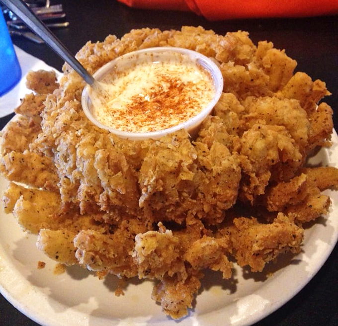 The blooming onion: where a humble vegetable transforms into a golden-brown flower of crispy deliciousness. Diet food? No. Worth every calorie? Absolutely.