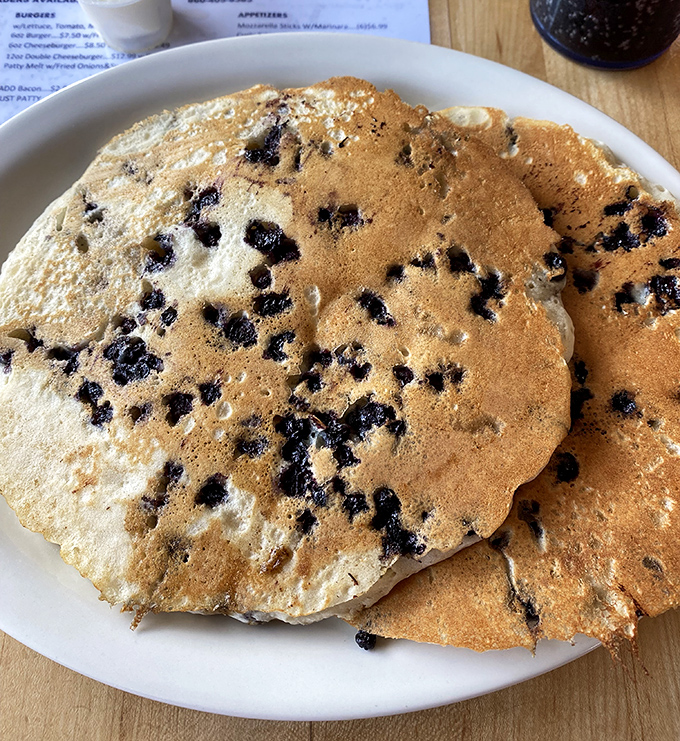Blueberry pancakes that look like they're auditioning for a breakfast calendar shoot&mdash;fluffy, studded with berries, and practically begging for a maple syrup waterfall.