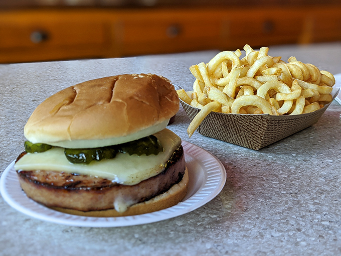 The famous bologna sandwich in all its glory &ndash; thick-cut, grilled to perfection, and topped with cheese and pickles. This isn't your lunchbox bologna.