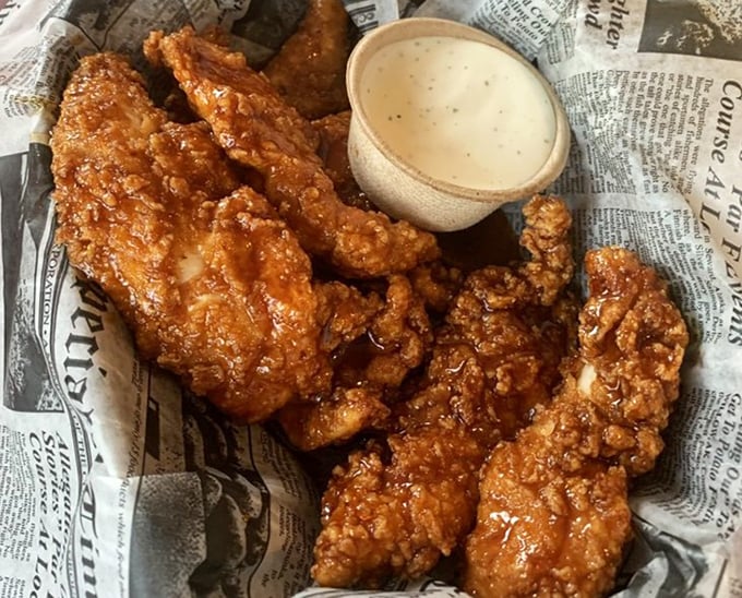 These aren't just wings; they're crispy vessels of happiness served on newspaper &ndash; because good food should be headline-worthy.