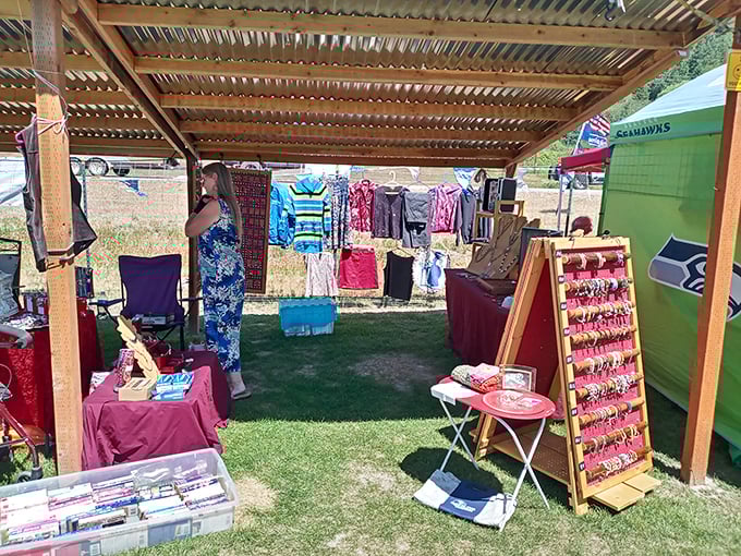 Under a rustic wooden shelter, DVDs and clothing create the ultimate analog shopping experience&mdash;no "add to cart" button required. 