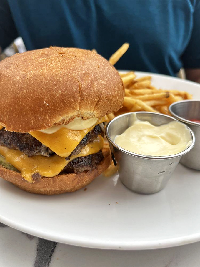 Meet the burger that launched a thousand food pilgrimages. Two patties, melted cheese, and a brioche bun that deserves its own fan club.