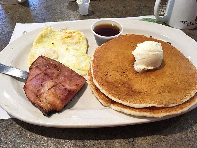 Pancakes so perfectly golden they deserve their own Instagram account. That ham looks like it's auditioning for a food magazine cover.