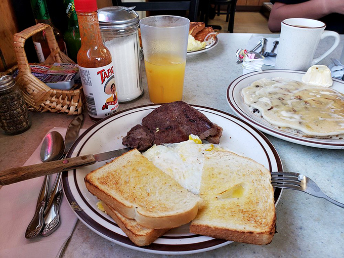 Breakfast of champions? More like breakfast of people who appreciate a properly cooked steak, eggs with personality, and toast that doesn't apologize for being bread.