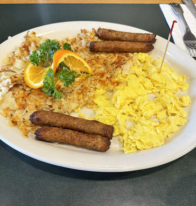 The breakfast trifecta: golden hash browns, fluffy scrambled eggs, and sausage links that snap with each bite. The holy trinity of morning meals.