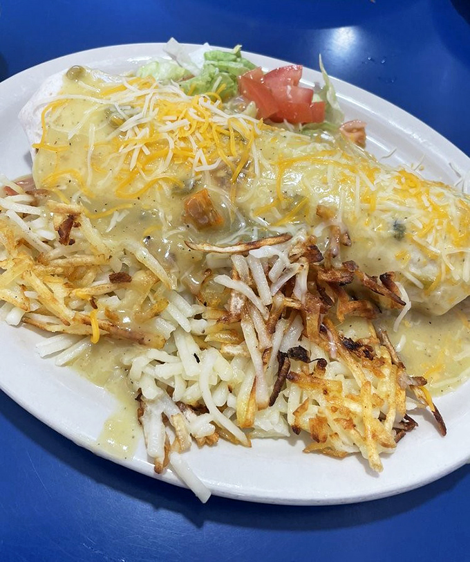 This breakfast burrito sits on the plate like it's ready for its close-up, loaded with everything good in life.