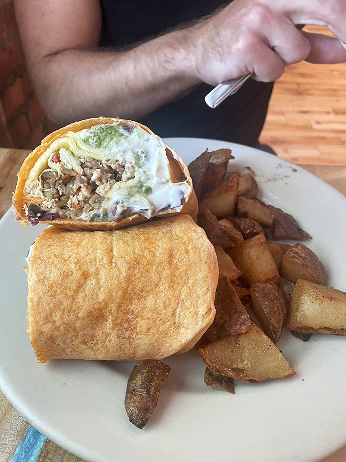 This breakfast burrito doesn't just say good morning&mdash;it serenades you. Packed with savory goodness and served with home fries that could make a potato proud.