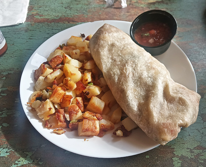 This breakfast burrito isn't just a meal, it's a commitment &ndash; stuffed with morning goodness and served with potatoes that could make an Idaho farmer proud.