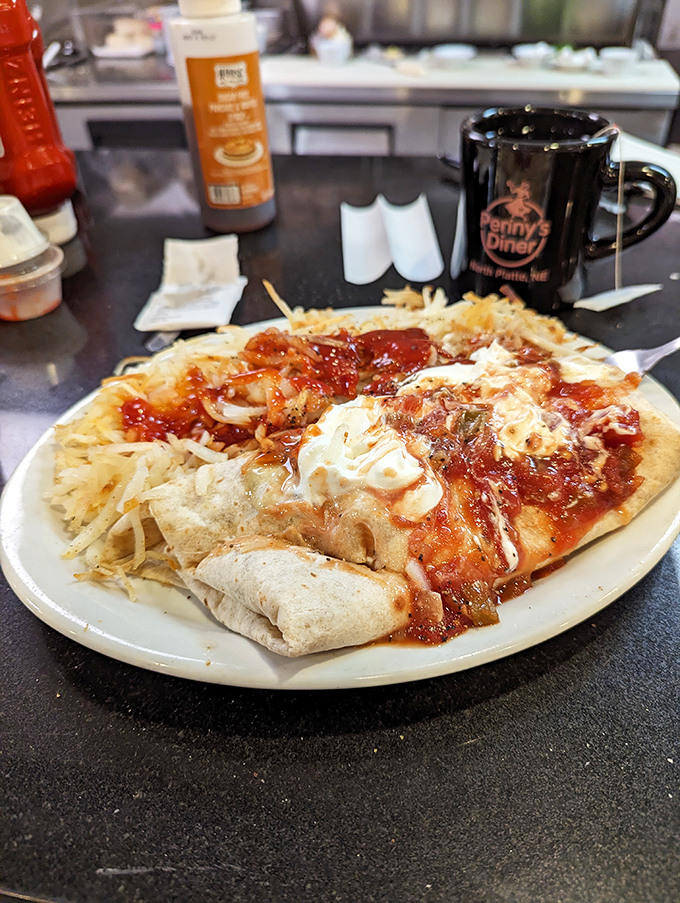 A hearty plate featuring what appears to be enchiladas alongside a burrito&mdash;proof that Penny's repertoire extends beyond classic diner fare.