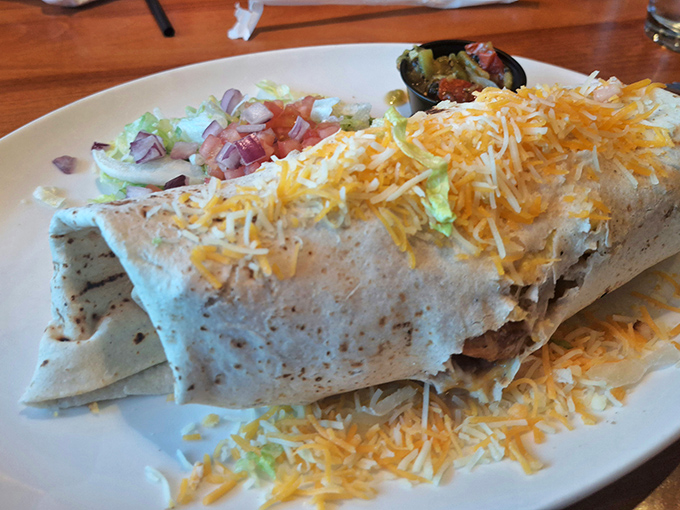 Behold the breakfast burrito in its natural habitat&mdash;wrapped in a tortilla blanket, smothered in cheese, and ready to cure whatever ailed you yesterday.