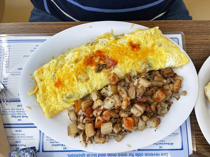 The Western omelet doesn't just sit on the plate &ndash; it commands attention. Perfectly folded around melty cheese with a side of home fries that achieved the holy grail: crispy outside, tender inside.