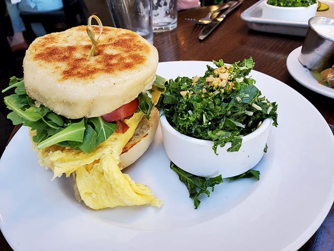 The breakfast sandwich that launched a thousand return visits. Golden eggs and fresh greens between English muffins that put store-bought to shame.