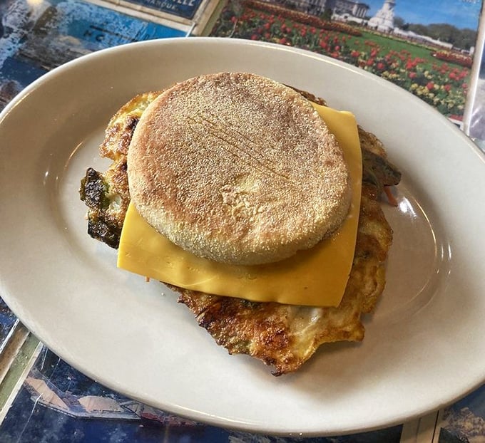 Breakfast architecture at its finest. This English muffin sandwich construction project combines melty cheese, eggs, and meat into handheld perfection.