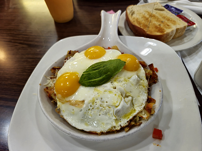 Sunny-side up eggs crown this hearty skillet like jewels, with avocado adding that quintessential California touch.
