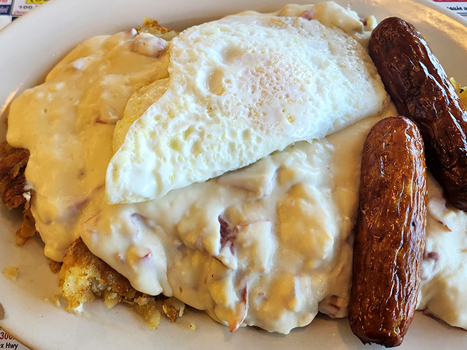 Behold the breakfast of champions: eggs, sausage, and gravy-smothered potatoes. This plate doesn't just start your day—it launches it into orbit.