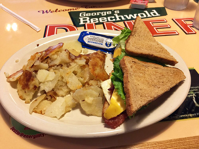 Breakfast sandwich architecture at its finest, where every ingredient earns its place between perfectly toasted bread slices.
