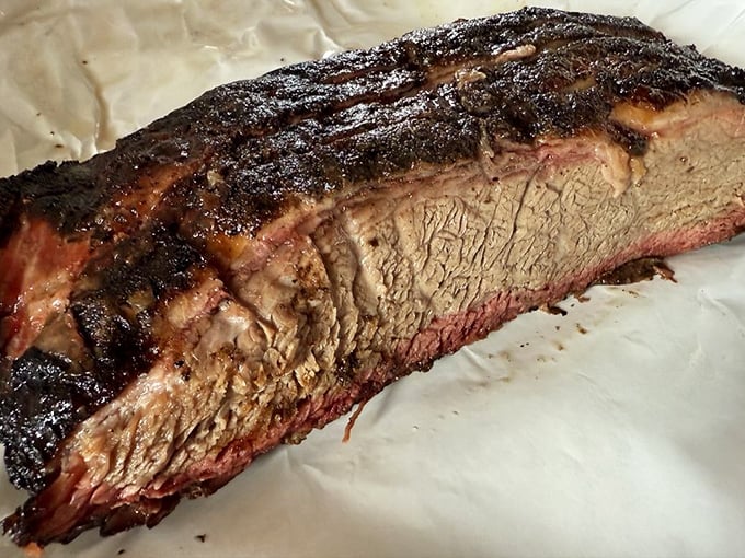 This brisket has the kind of smoke ring that makes pitmasters weep with joy. The perfect marriage of pepper, smoke, and time.