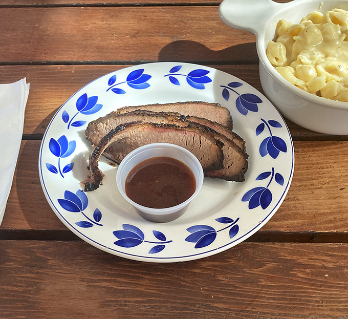 The holy grail of barbecue: perfectly smoked brisket with that coveted pink smoke ring. Simple presentation lets the meat speak its delicious truth.