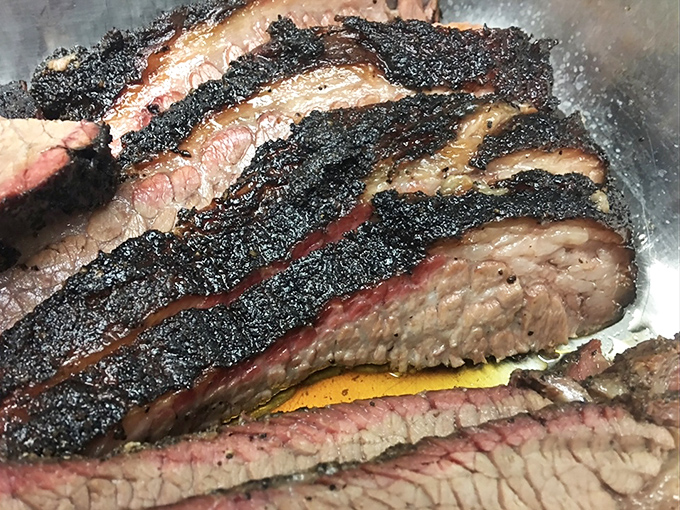 Brisket with a smoke ring so perfect it could be framed. That pink halo is nature's way of saying "you're welcome."